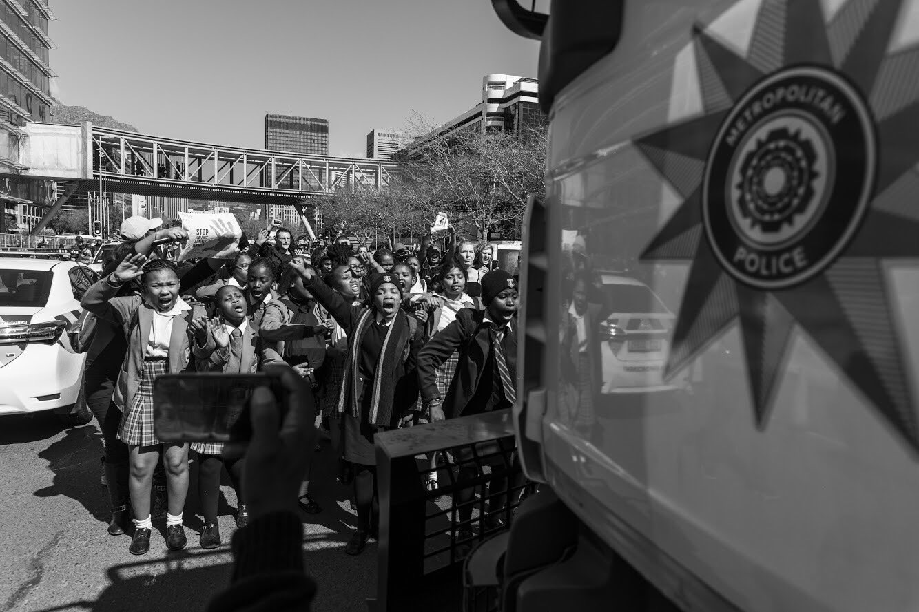 Student protesting in front of the Police Water truck during the Am I ...